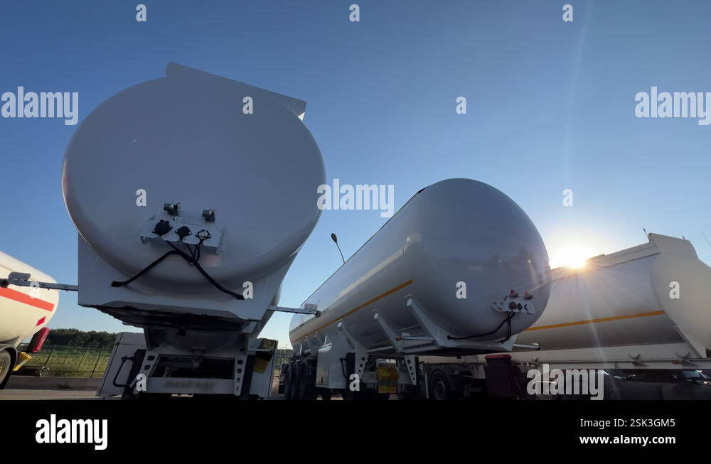 Empty fuel tanks stand in the parking lot of the oil depot, waiting to ...