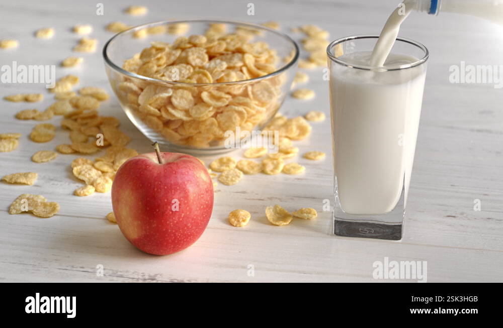 Summer breakfast healthy morning food corn flakes apple and milk ...
