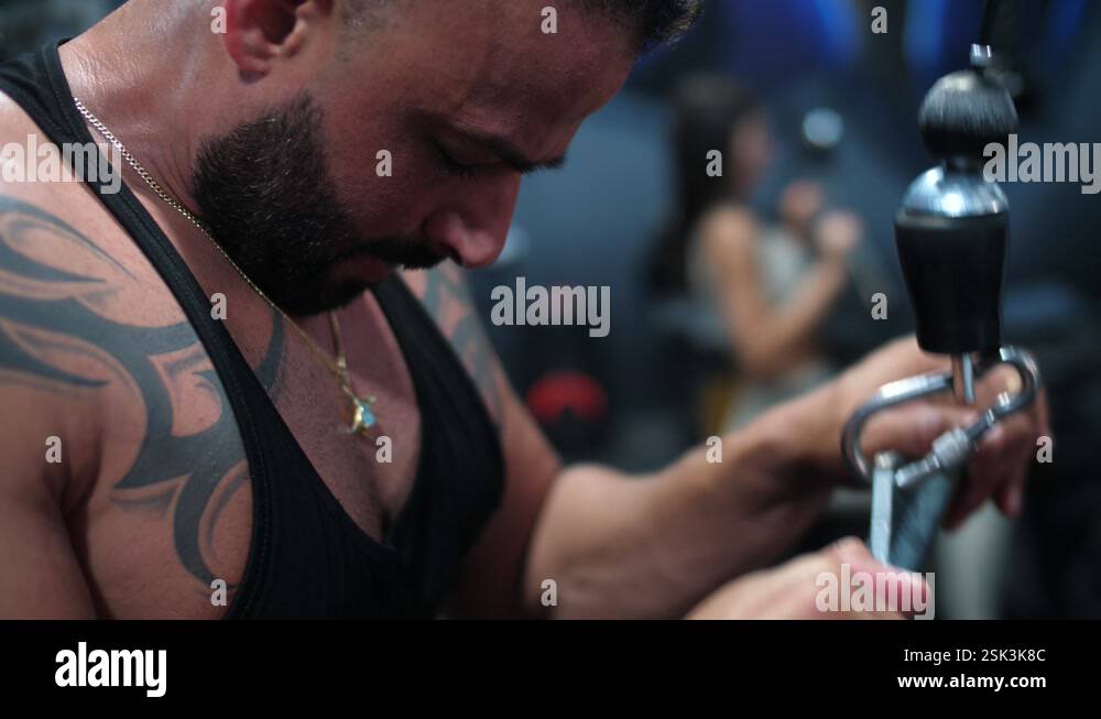 male bodybuilder engaging in weightlifting exercises within a dynamic ...