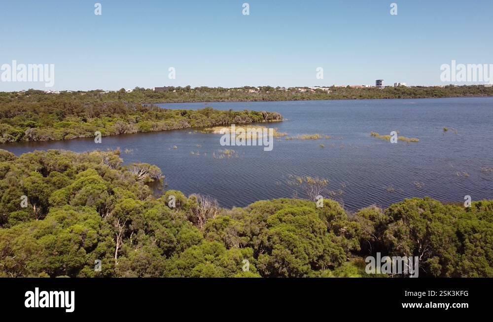 Panning shot right to left of Rotary Park Wanneroo and Lake Joondalup ...