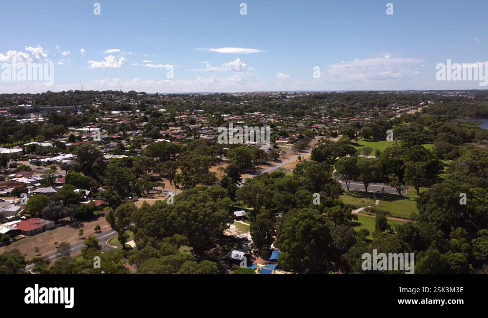 Crane shot of Rotary Park with residential area of Wanneroo in ...
