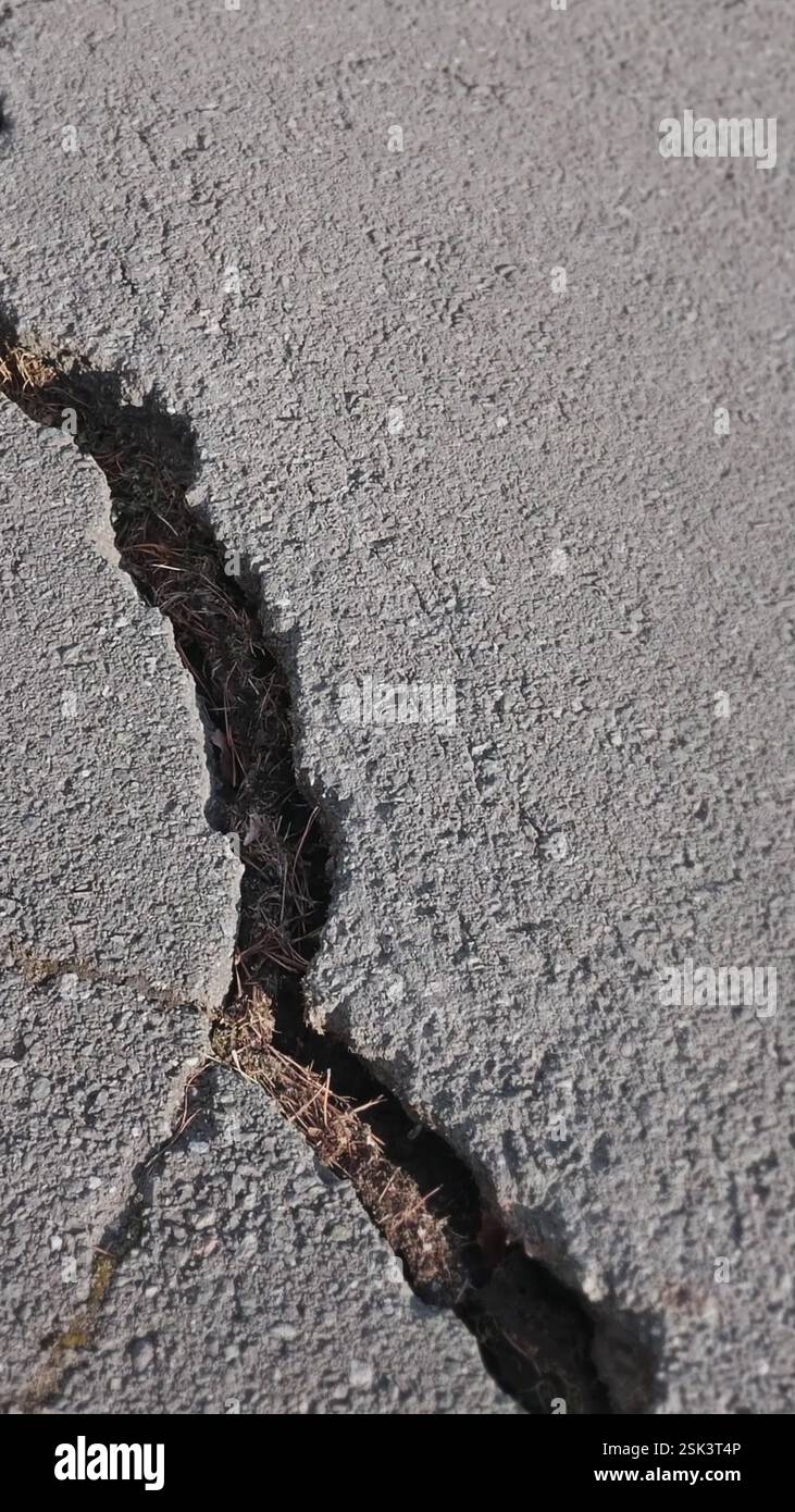 surface rupture on old highway, crack with deep fault on the road Stock ...