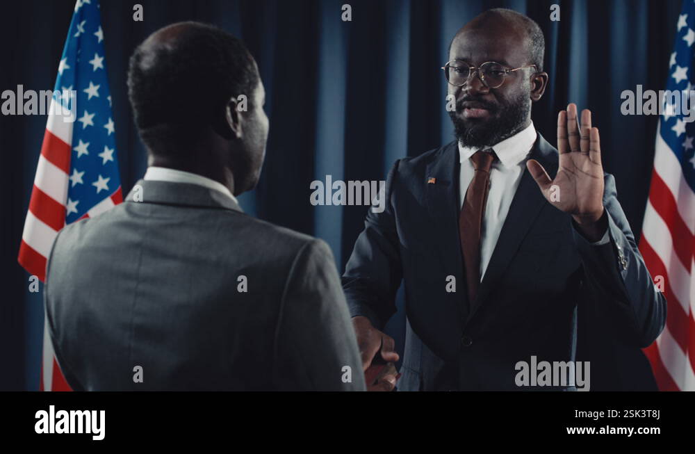 Black Male Politician Taking Oath on Holy Book at Inauguration Ceremony ...