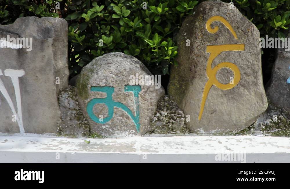 Buddhist monastery name in tibetan language from flat angle at day ...