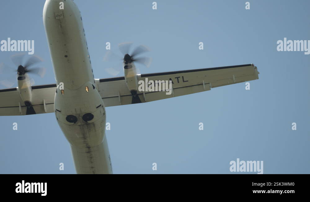 Looking straight up at a propellor airplane flying by Stock Video ...