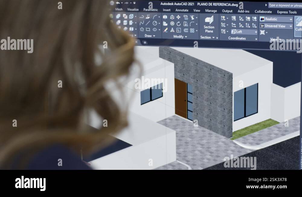 A Woman designs a house on a computer. digital home design program ...