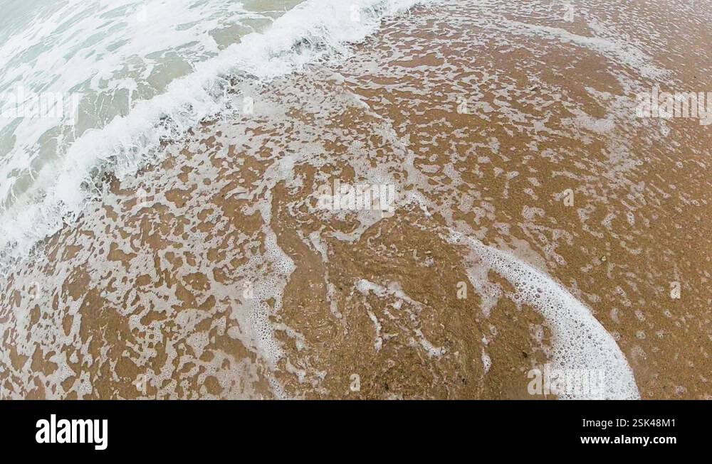 Sea Water Receding as New Wave Breaks Towards Beach - Slow Motion Stock ...