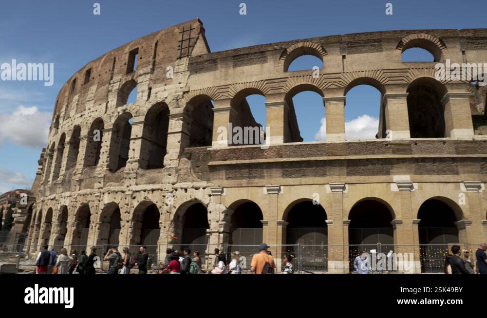 A cinematic view of The Colosseum in Rome where tourists come to see ...