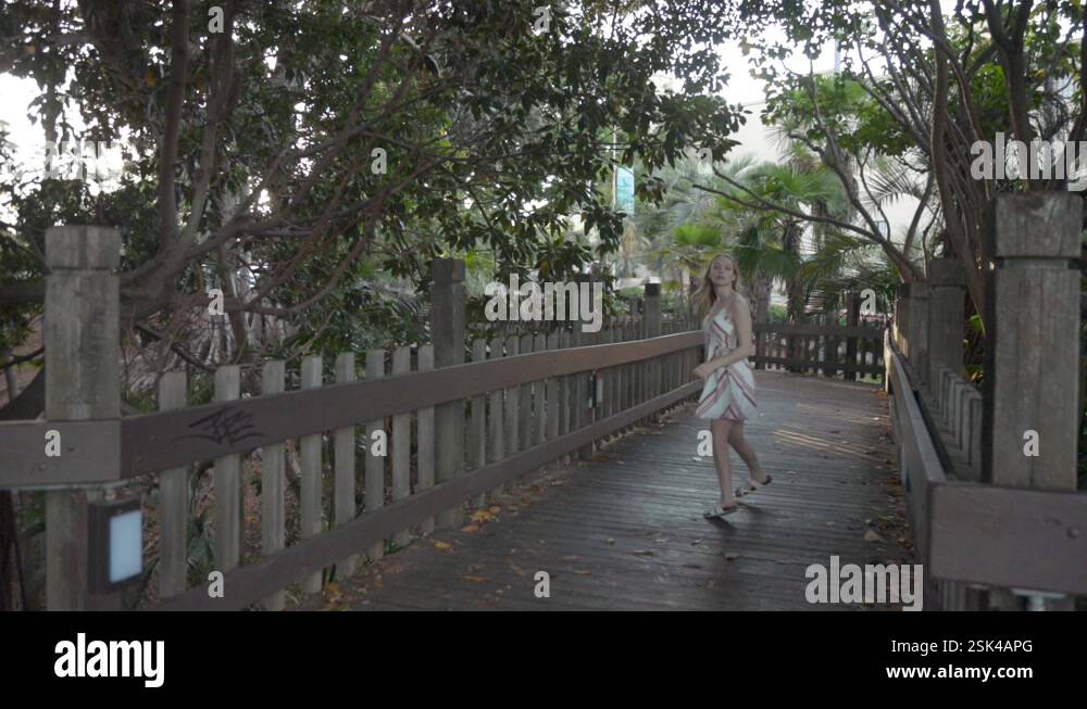Teenage Girl Escaping Danger in the Forest - Running Across Bridge in ...