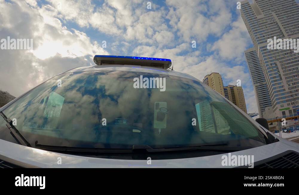 camera on hood of moving mbulance car, frontal view of windshield and ...