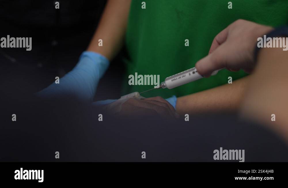 placement of anesthesia on the patient's hand operating room, hospital ...