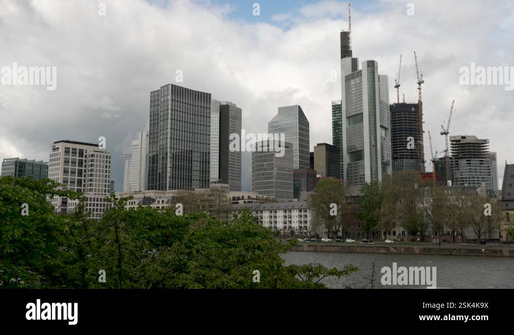 Frankfurt Skyline View From Across River Main Over Tree Line With Light ...