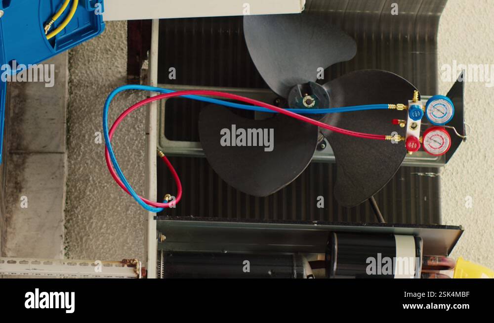 Vertical video Faulty condenser with cover removed Stock Video Footage ...