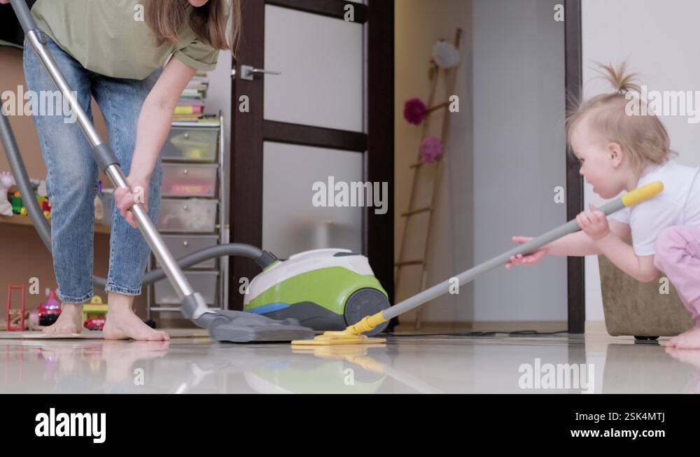 little daughter cleaning in the house, child dusting, Cute little ...