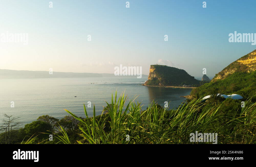 Beautiful cliff scenery of Gerupuk surf spot in golden hour, Indonesia ...