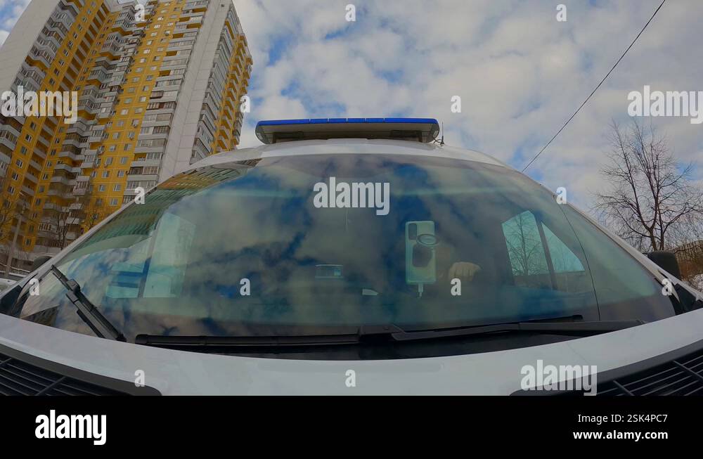 paramedics inside ambulance auto moving on street, frontal view of ...