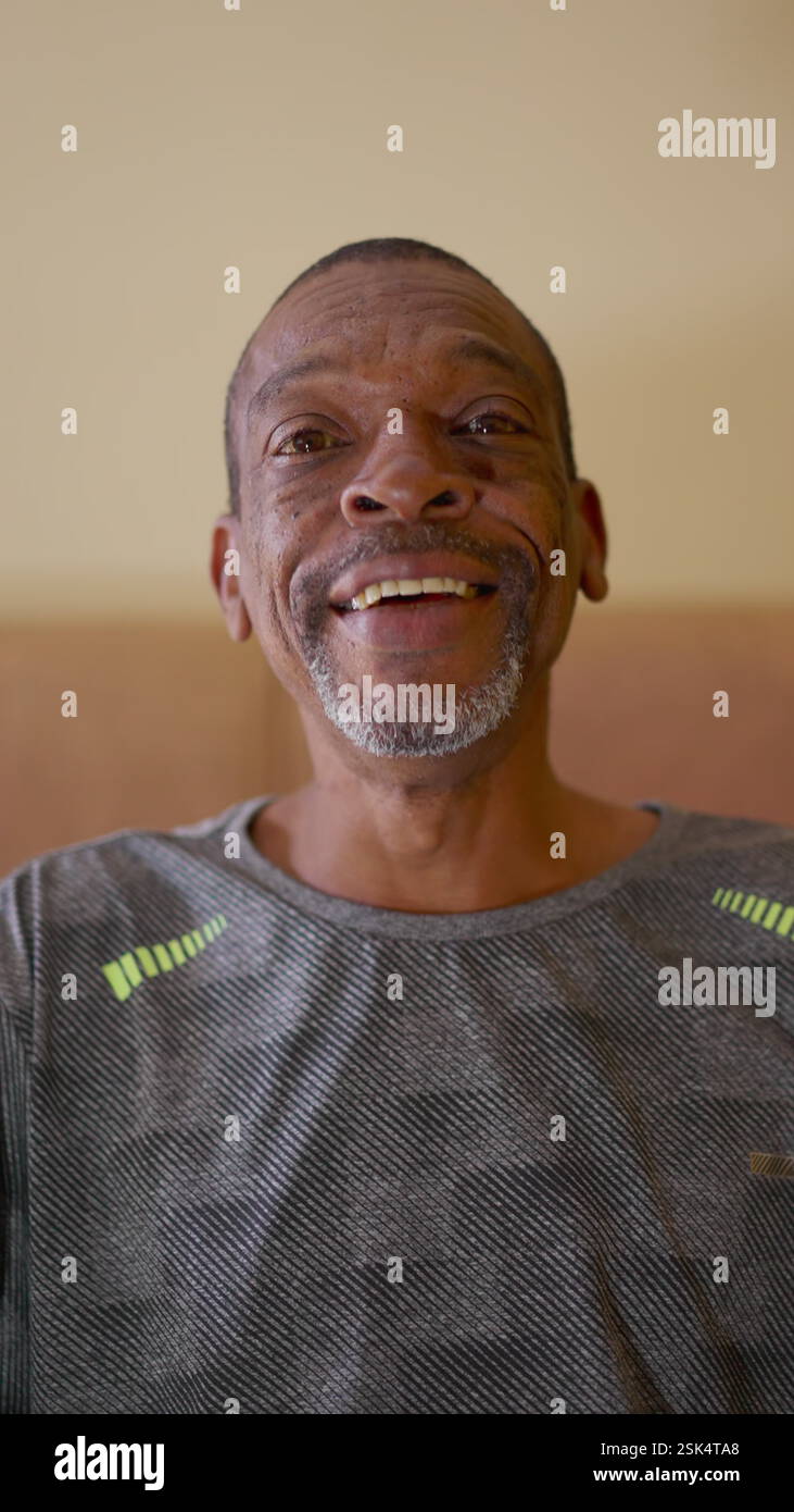 One black man speaking to camera in POV webcam video conference ...