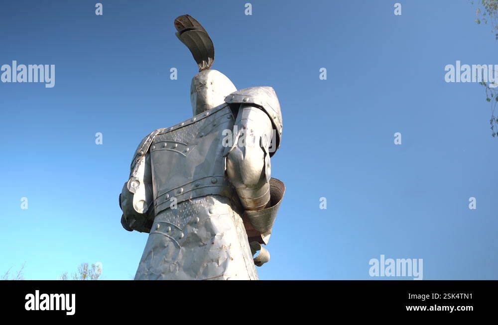 rear view Medieval knight statue with armor and sword with shield stock ...