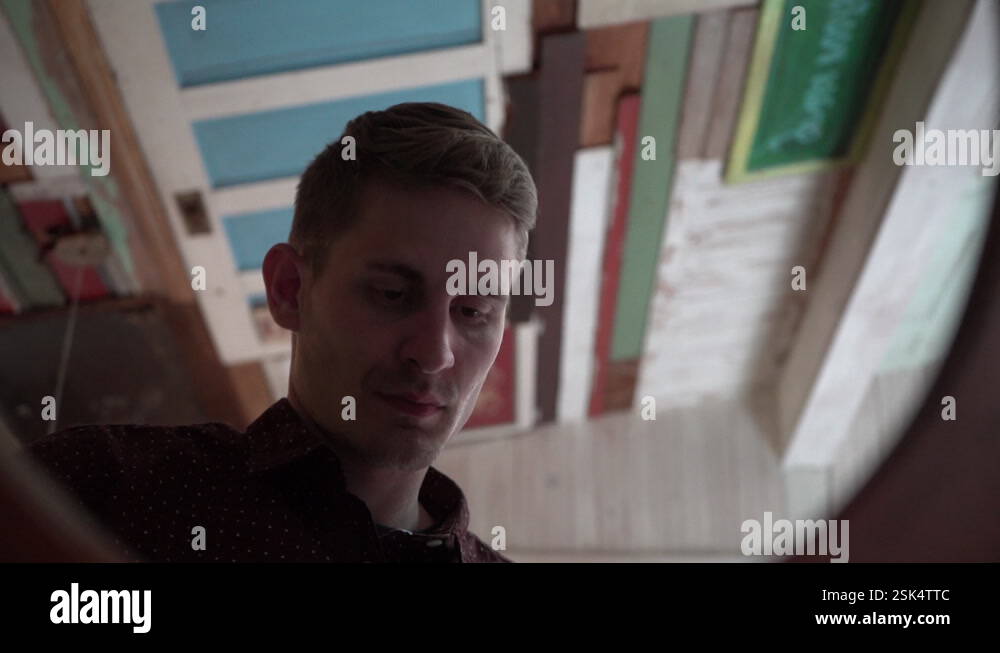 white blonde man filming with camera gimbal stabilizer mirror footage ...
