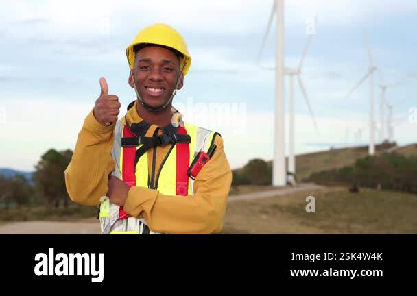 Engineer showing thumbs up working in a wind turbine park Stock Video ...