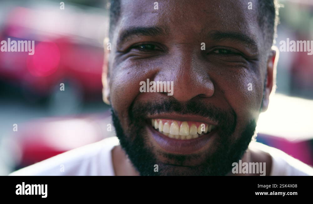 One happy black Brazilian man close-up face smiling. Joyful friendly ...