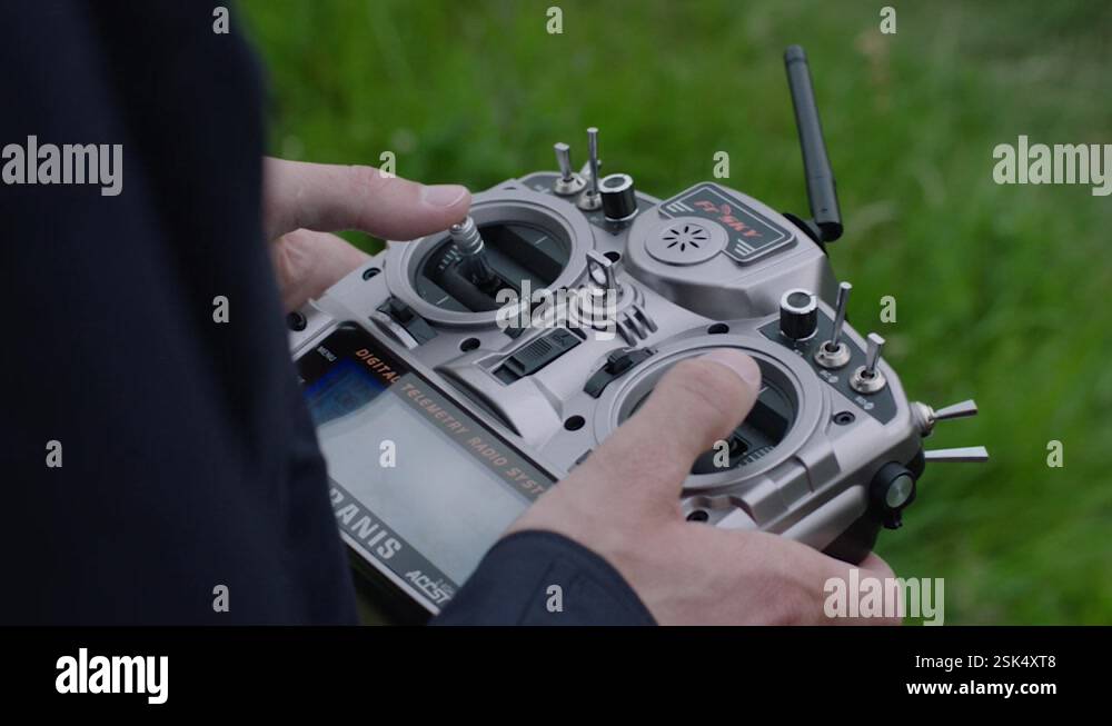 Close-up fingers controlling joystick of professional FPV race drone ...