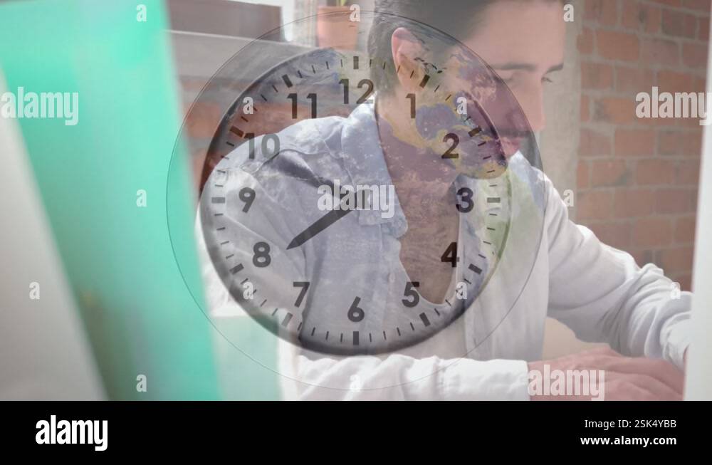 Animation of clock ticking over caucasian businessman using computer ...