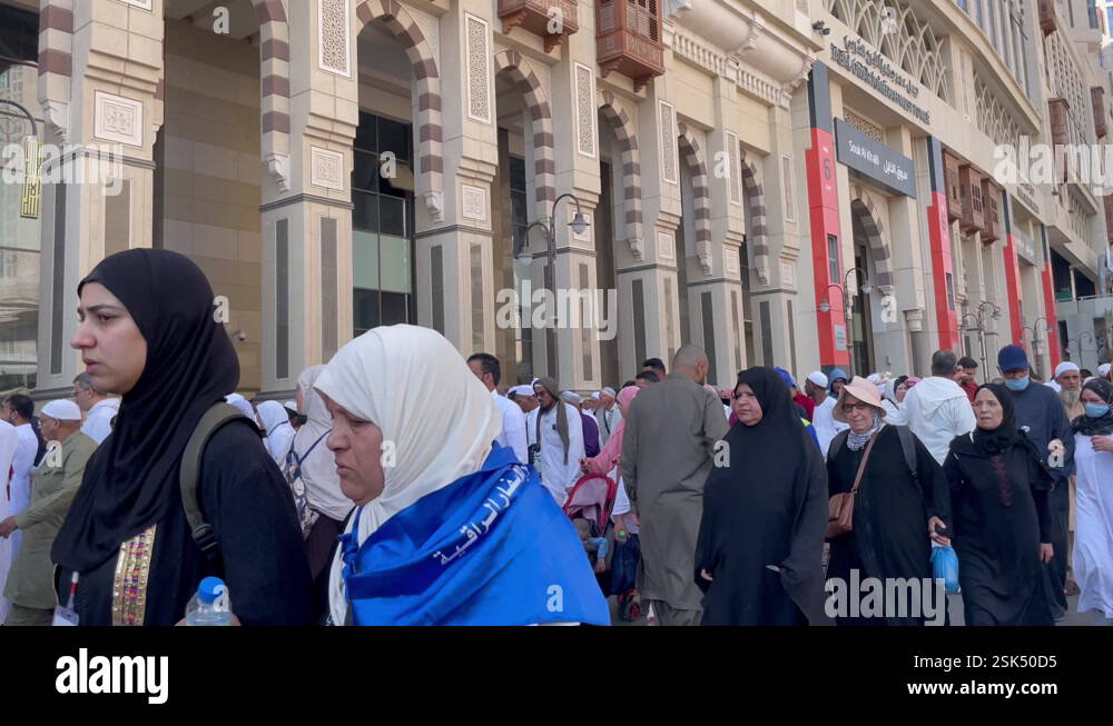 Pedestrians walking on a city street, Mecca, Saudi Arabia Stock Video ...