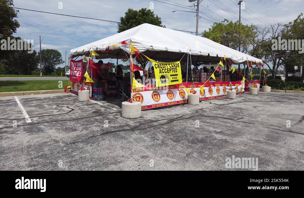 Fireworks tent stand popup fourth of july slow gimbal shot in parking ...