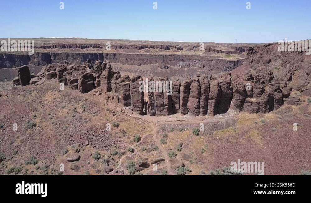 Aerial orbits massive free standing rock columns in Frenchman Coulee ...