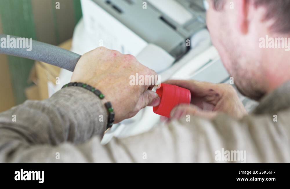 Chamfering of copper pipe. process of removing pointed edge at end of ...