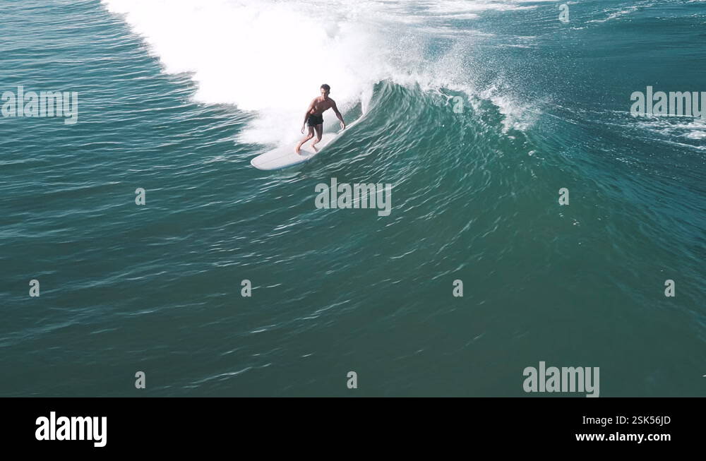 CANGGU, BALI - JUNE 2023: Man surfs the wave on famous surfing spot of ...