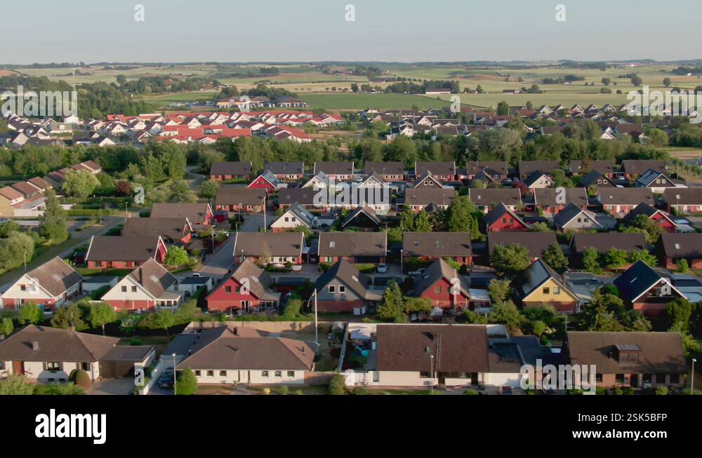 Calm neighbourhood in Staffanstorp, Sweden. Aerial dolly shot left ...