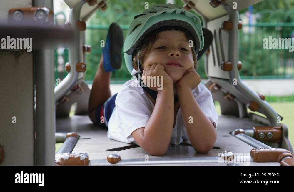 Portrait of a pensive child thinking with hands in chin with dreamy ...