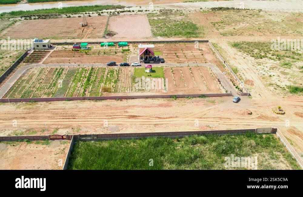 A drone aerial establishing shot over a classic beautiful farmhouse ...