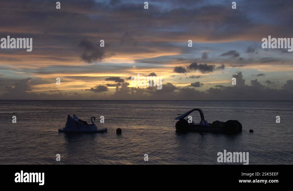 Pedal boats floating in ocean Stock Video Footage - Alamy