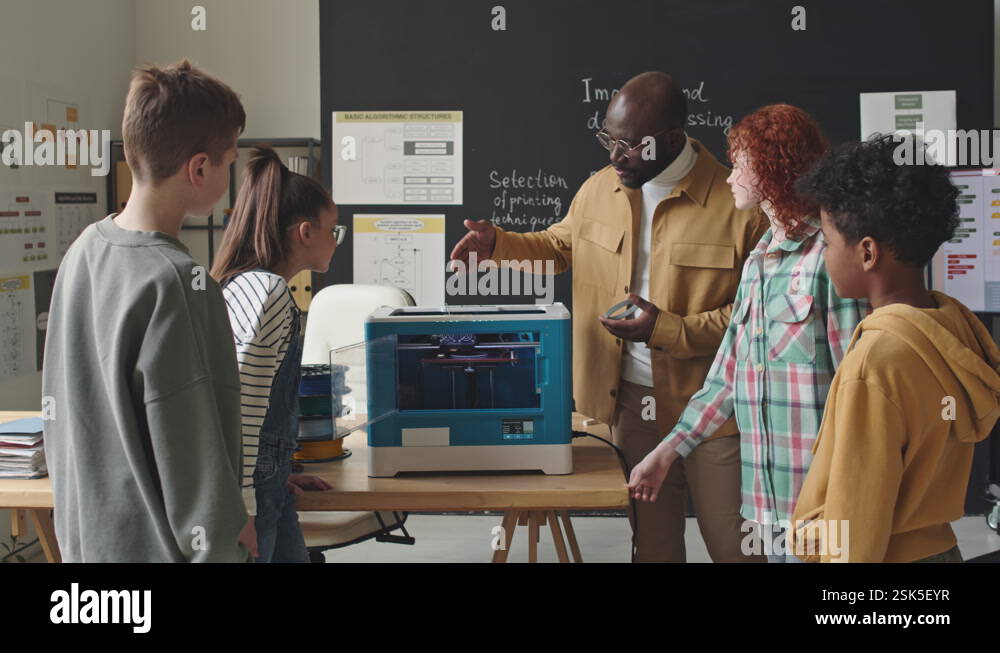 Kids Learning 3D Printing with Male Teacher Stock Video Footage - Alamy