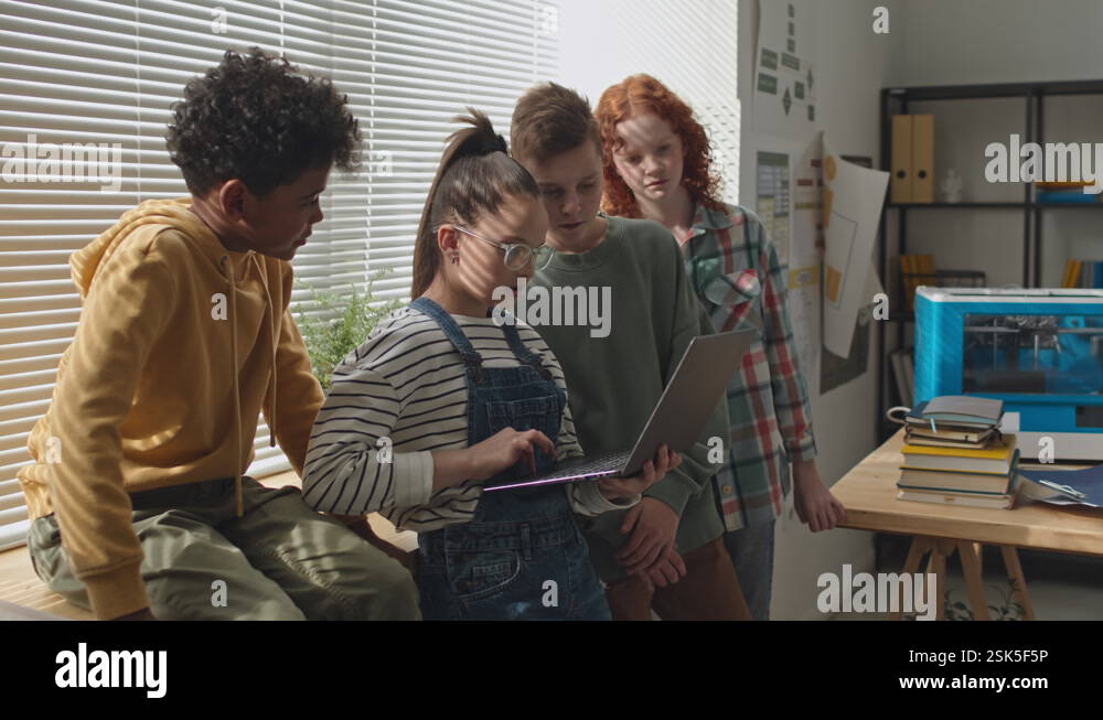 Little Classmates Discussing Code on Laptop in Primary School Stock ...