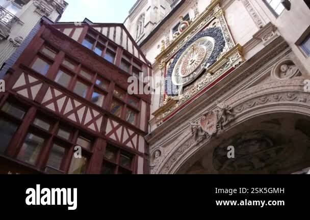 A clock tower in front of a building. High quality footage Stock Video ...