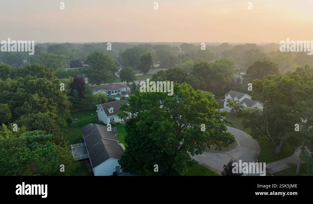 Sun rising over a small Michigan town coated in wildfire smoke from ...