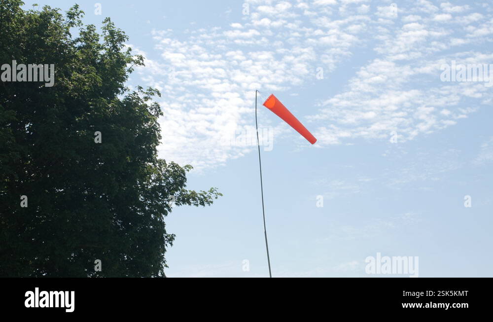 Airfield wind direction windsock flag in summer Stock Video Footage - Alamy
