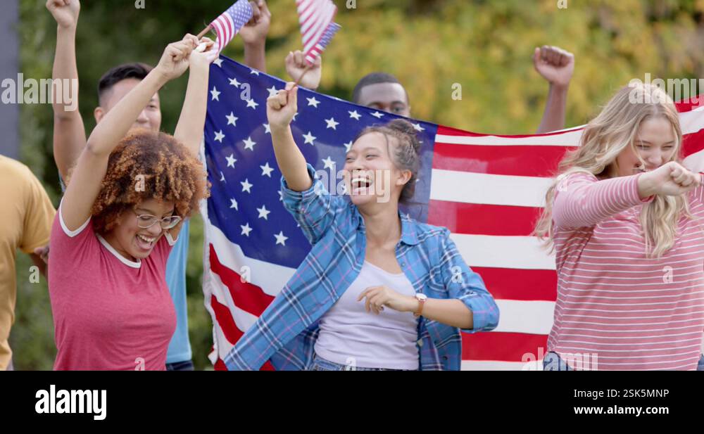 Happy diverse group of friends holding flags of usa and celebarting in ...