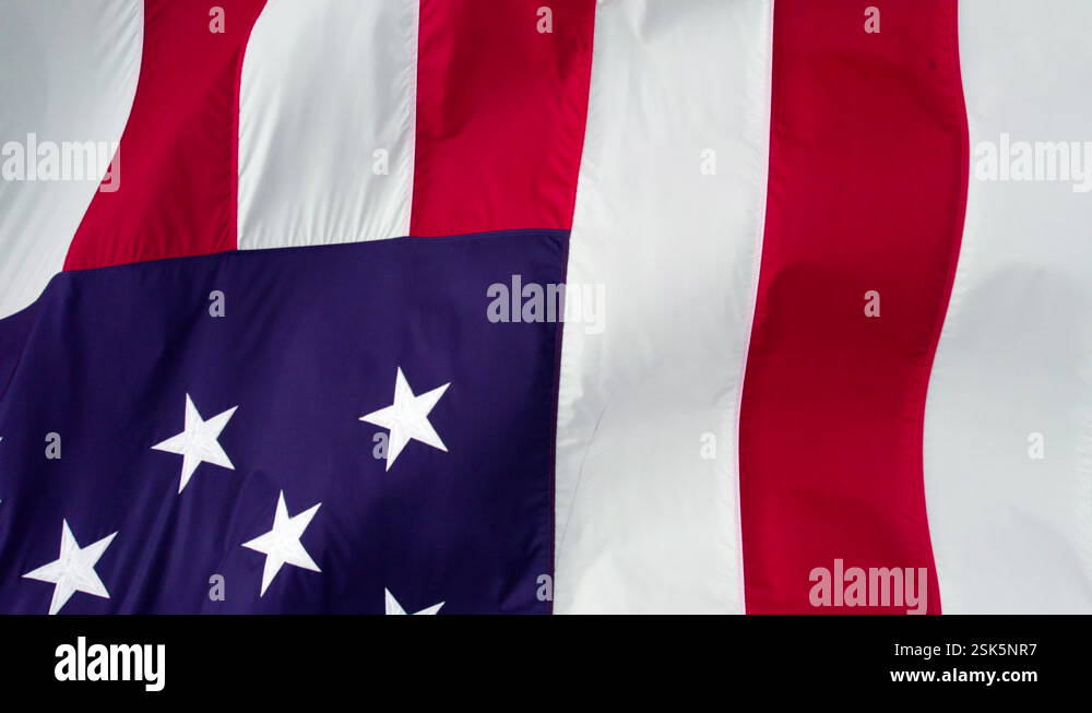 Downward aerial view over the waving American flag Stock Video Footage ...