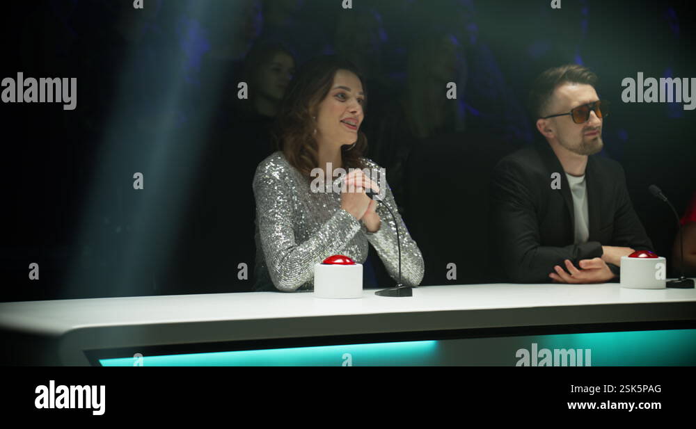 Portrait of TV talent show celebrity judges telling their opinion after ...