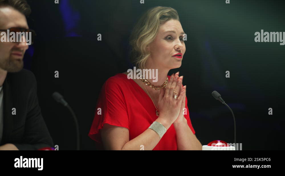 Portrait of TV talent show celebrity judges telling their opinion after ...