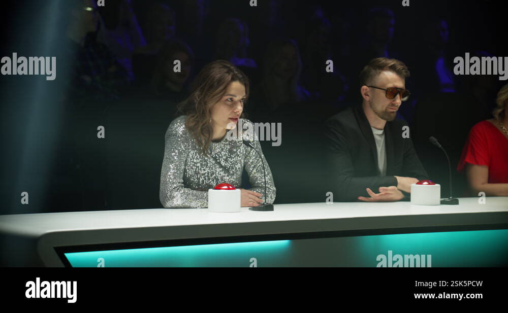 Portrait of TV talent show celebrity judges telling their opinion after ...