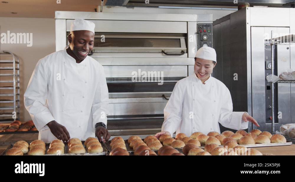 Portrait of happy diverse bakers working in bakery kitchen with fresh ...