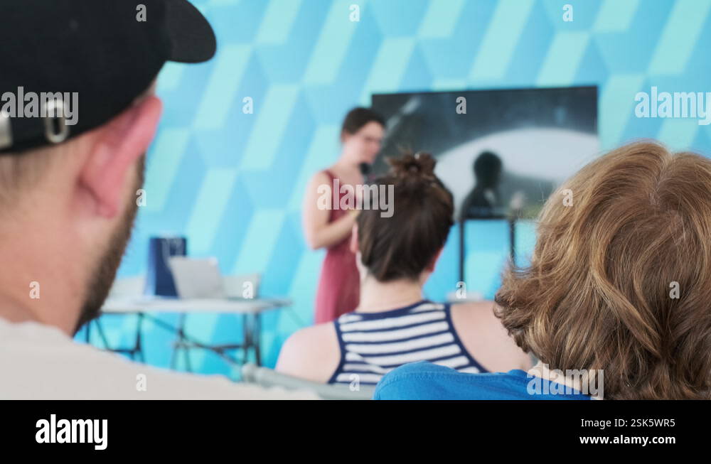 Anonymous woman speaking on stage during business meeting with ...