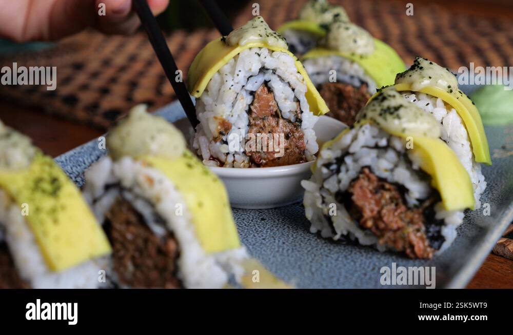 Take Sushi sticks and dip them in soy sauce at a Japanese restaurant ...