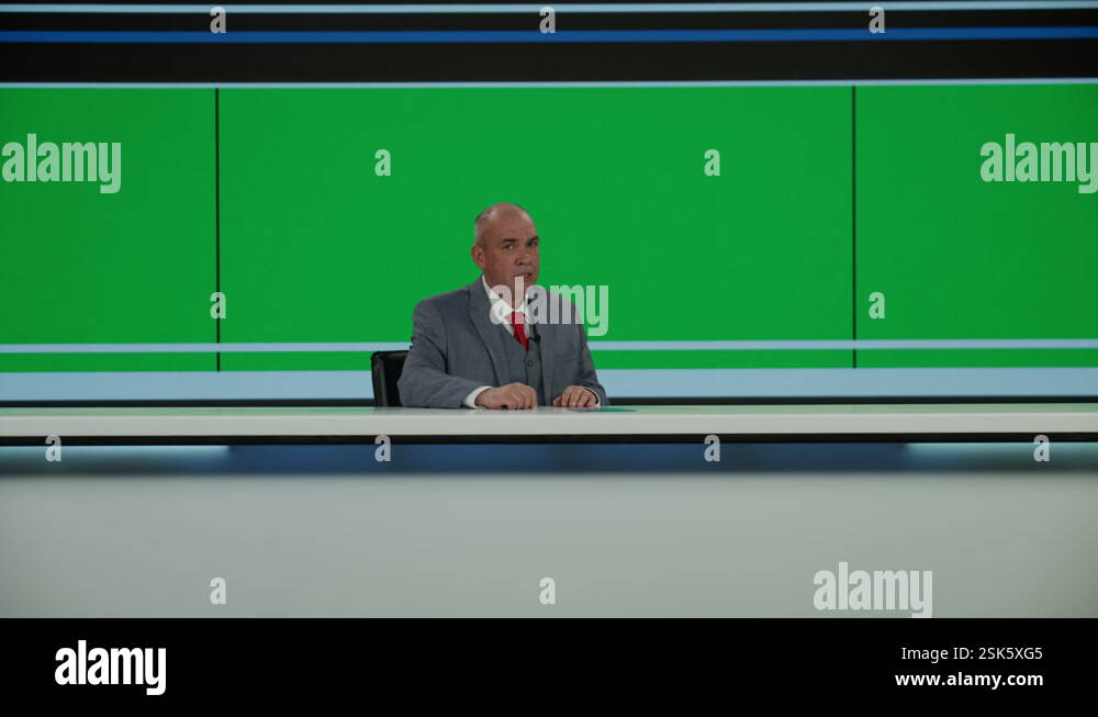 GREEN SCREEN Caucasian male anchorman reporting on a story in live news ...